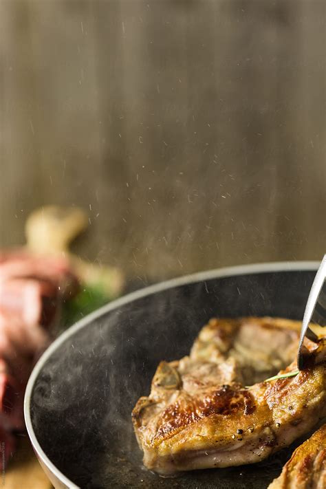 Frying Lamb Chops In A Pan By Stocksy Contributor Kirsty Begg Stocksy