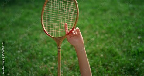 Closeup Badminton Racket In Hands Of Smiling Joyful Girl Lying On Blanket Stock Photo Adobe Stock
