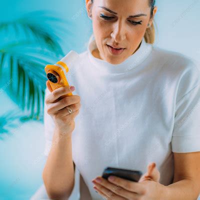 Woman Using Spirometer Stock Image F027 7004 Science Photo Library