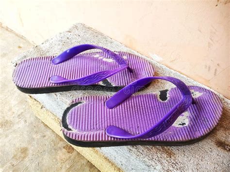 A Pair Of Worn Out Flip Flops In Front Of The House Stock Image Image
