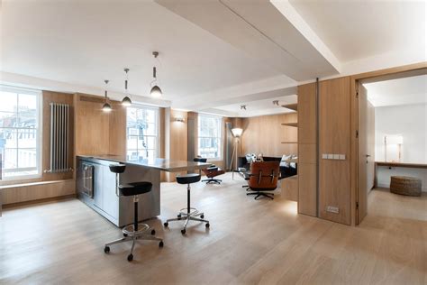 Sirs Clads Renovated London Apartment In Panels Of Marble And Oak
