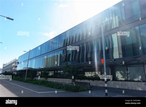 Modern Low Rise Glass Facade And Reflections Architecture In Silhouette