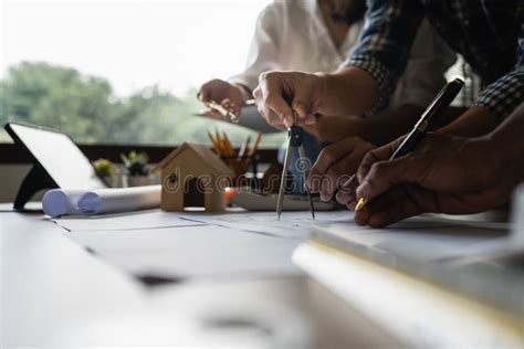Architect Man Working With Blueprints For Architectural Plan Engineer