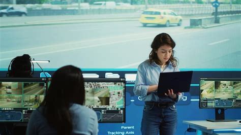 Premium Photo Young Manager Analyzing Traffic Surveillance Data With Her Employees Team
