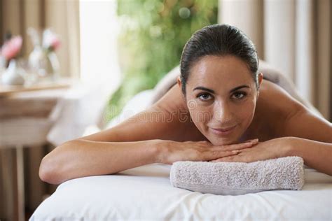 You Really Should A Massage Portrait Of An Attractive Woman Resting On A Massage Table Stock