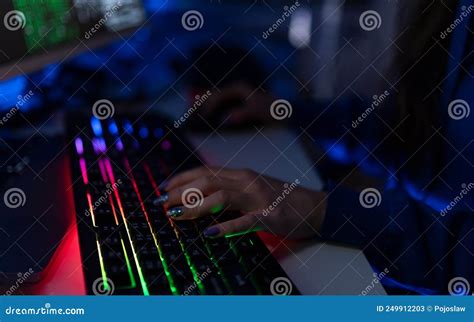 Close Up Of Woman Hacker Hands At Keyboard Computer In The Dark Room At Night Cyberwar Concept