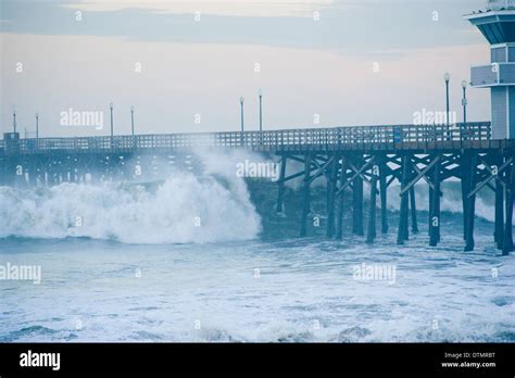 Seal Beach California Pier With Large Huge Massive Waves Crashing