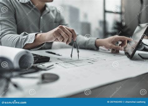 Architect Using Divider Compass Working On Blueprint House Planning Design And Construction