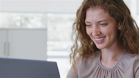 Close Up Portrait Of Businesswoman Sitting On Workplace In Office