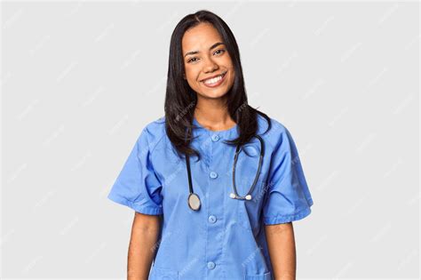 Premium Photo Young Filipina Nurse Posed In Studio Happy Smiling And