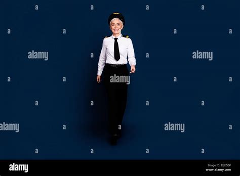 Full Body Photo Of Attractive Senior Woman Passenger Plane Captain Walking Dressed Aviator