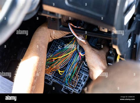 Auto Technician Diagnose And Fixing Wiring Problem Of Car Stock Photo Alamy