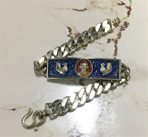 เปิดเลส หลวงพ่อรวย รุ่น รวยโภคทรัพย์ เนื้ออัลปาก้า ขนาด 2 บาท ลงยาแดง น้ำเงิน เปิดที่ เส้นละ