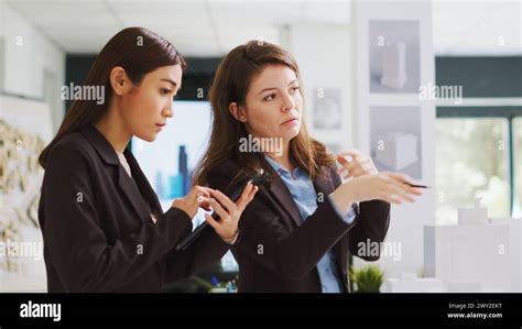 Developers Measuring 3d Building Model To Create Blueprints Examining Maquette To Design