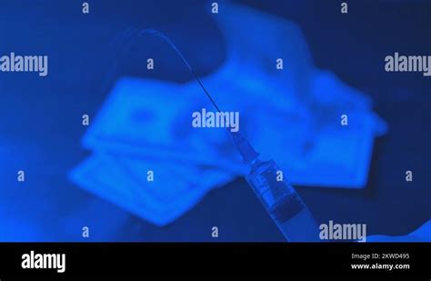 Men Collect And Release The Air Out Of The Syringe And Inject It Money