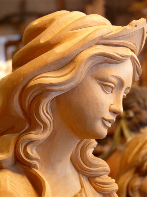 Download Wooden Sculpture Elegant Female Figure Wallpaper