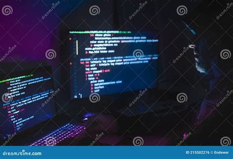 Computer Hacker Silhouette Of Hooded Man Using Laptop And Monitor For Steal Data Cyber Crime