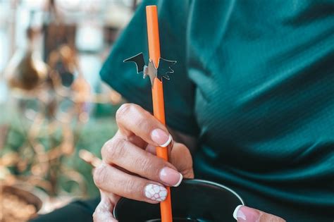 Premium Photo Close Up Of Hand Holding Dart