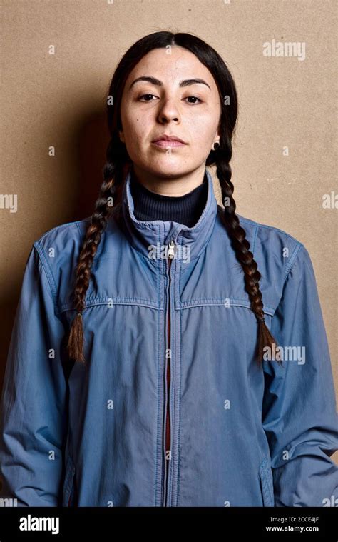 Girl With Blue Jacket And Without Make Up With The Same Hairstyle As
