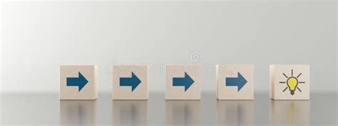 Row Of Wood Blocks With Arrows Leading To Light Bulb Symbol On Table Idea Or Innovation Or