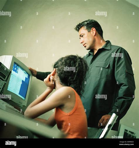 Man And Girl Using Computer Stock Photo Alamy