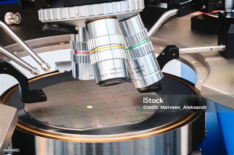 Close Up Examining Test Sample Microchip Transistor Under Microscope In Laboratory Equipment For