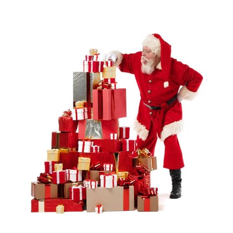Premium Photo Santa Claus Putting Heap Of Ts