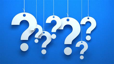 Premium Photo A Blue Paper With Question Marks Hanging From Strings