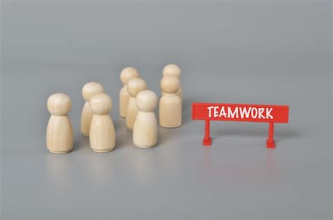 Premium Photo A Group Of Wooden Figure With Text Teamwork Unity And