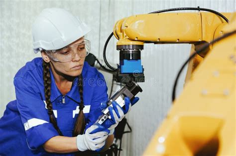 Female Automation Machine Engineer Student Study And Inspection Control Robot Arm Machine In