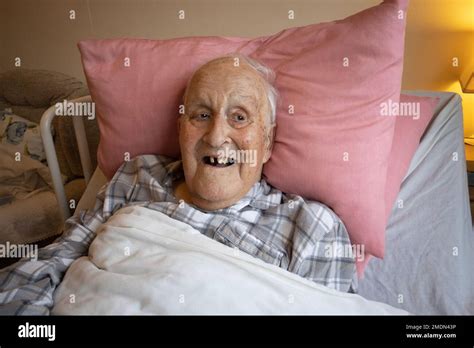 89 Year Old Man Lying In His Bed Whilst Living At A Care Home In