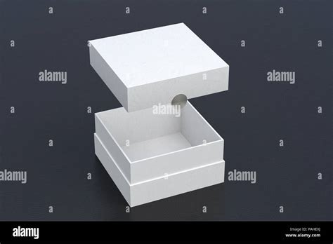 Opened White Empty Square Box With Cover Flying Above Box On Dark