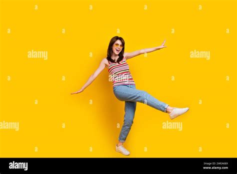 Full Size Photo Of Cute Woman Dressed Knitwear Top Jeans Pants In Sunglass Hands Wings Fooling