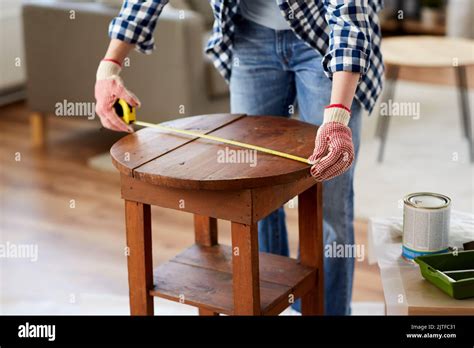 Woman With Ruler Measuring Table For Renovation Stock Photo Alamy