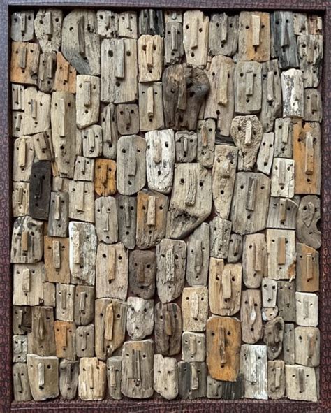 Countless Astonished Faces Emerge From Driftwood In Expressive Sculptures By Marc Bourlier