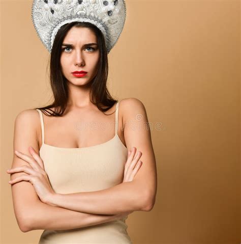 Picture Of Angry Young Woman Standing Over Nude Background Looking