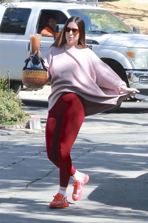 Scout Willis Wearing An Oversized Blush Sweater And Red Leggings Los