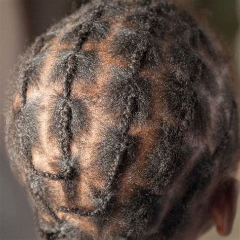 Extreme Close Up Of Small Plaits Looking Like Canerows On A Young African Girl From Behind Stock