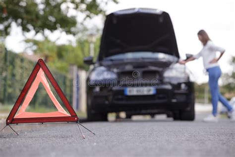 Woman After Placing Emergency Warning Triangle Sign Stock Image Image Of Stop Safety 148696673