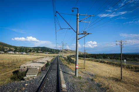 Premium Photo Railroad Track Passing Through Field