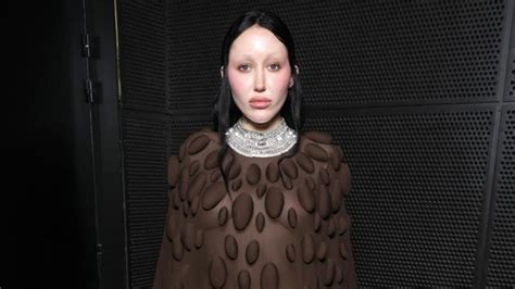 Noah Cyrus Makes A Rare Public Appearance In A Sheer Brown Cape Dress At Paris Fashion Week Home