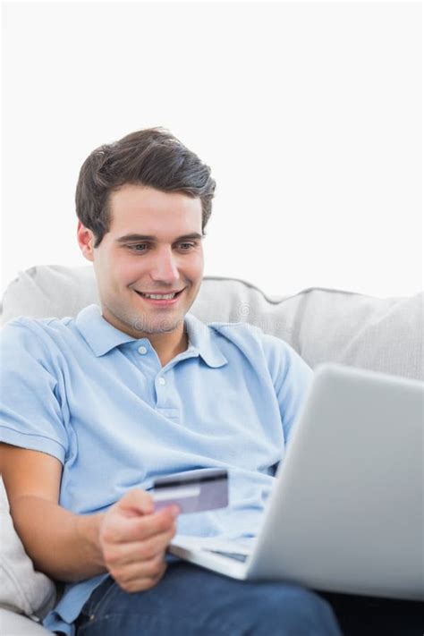 Man Using His Credit Card To Buy Online Stock Photo Image Of Browsing Cheerful