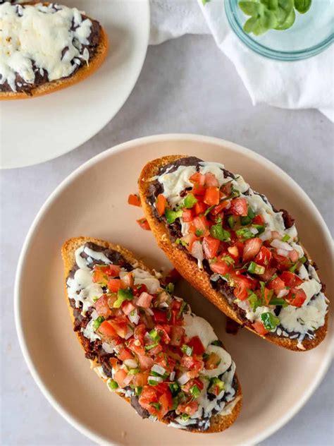 Mexican Molletes Are Toasted Bread Typically A Bolillo Roll Layered