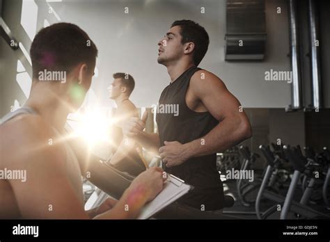 Men Exercising On Treadmill In Gym Stock Photo Alamy