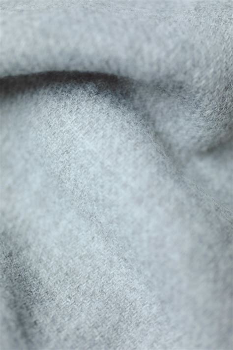 가정용 섬유 닳은 담요 디테일 따뜻한 뜨개질 매크로 모직 베이지 봉제 부드러운 부드러운 원단 부드러운 질감