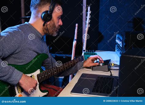 Musician Adjusting The Sound Of His Electric Guitar With Equalizer Stock Image Image Of