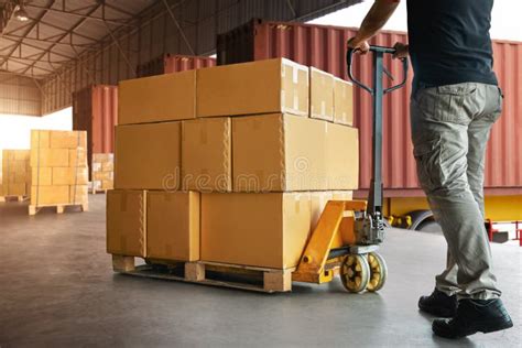Workers Unloading Packaging Boxes On Pallets In Warehouse Cartons Cardboard Boxes Shipping