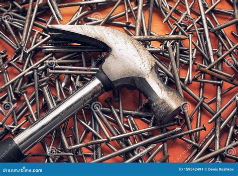 Hammer And A Bunch Of Construction Nails Closeup Repair Concept Stock