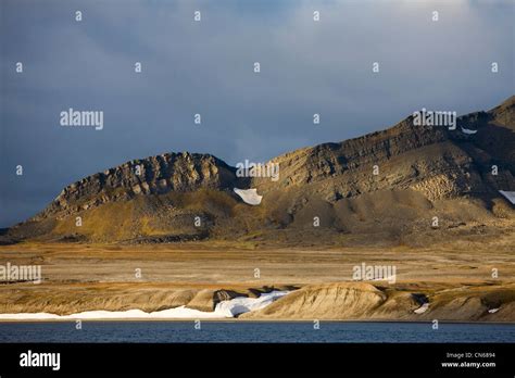Norway Svalbard Spitsbergen Island Setting Sun Lights Eroded Cliffs
