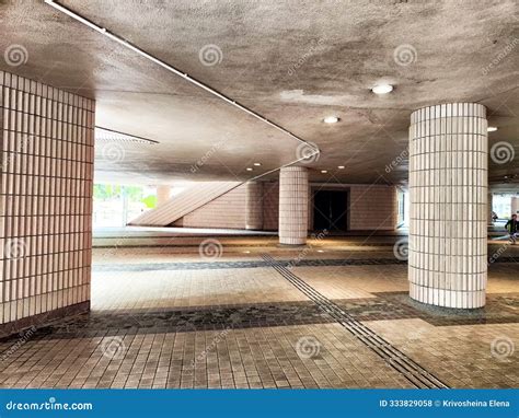 A View Of A Concrete Underpass With Tile Columns And A Tiled Floor